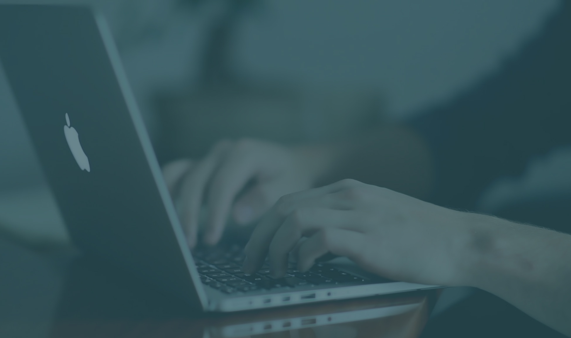 blue_typing_still | Caminiti Associates Inc